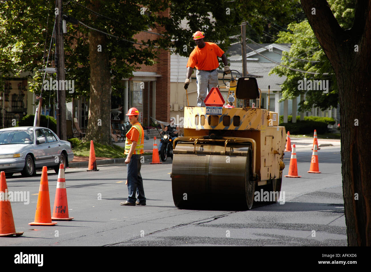 Steam roller paving street Stock Photo - Alamy