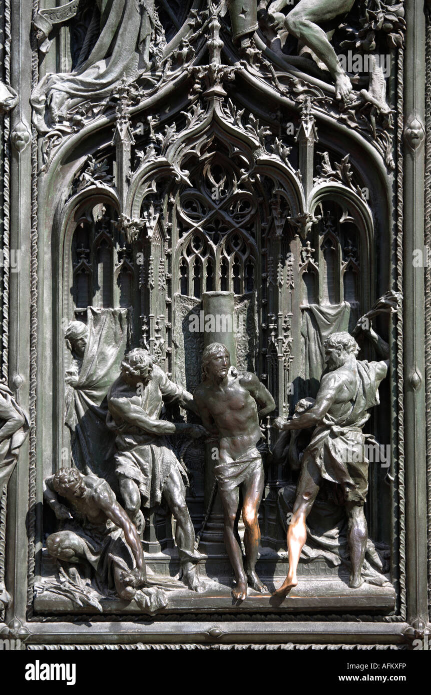 Detail of the main gate of Duomo, Milan, Italy Stock Photo - Alamy