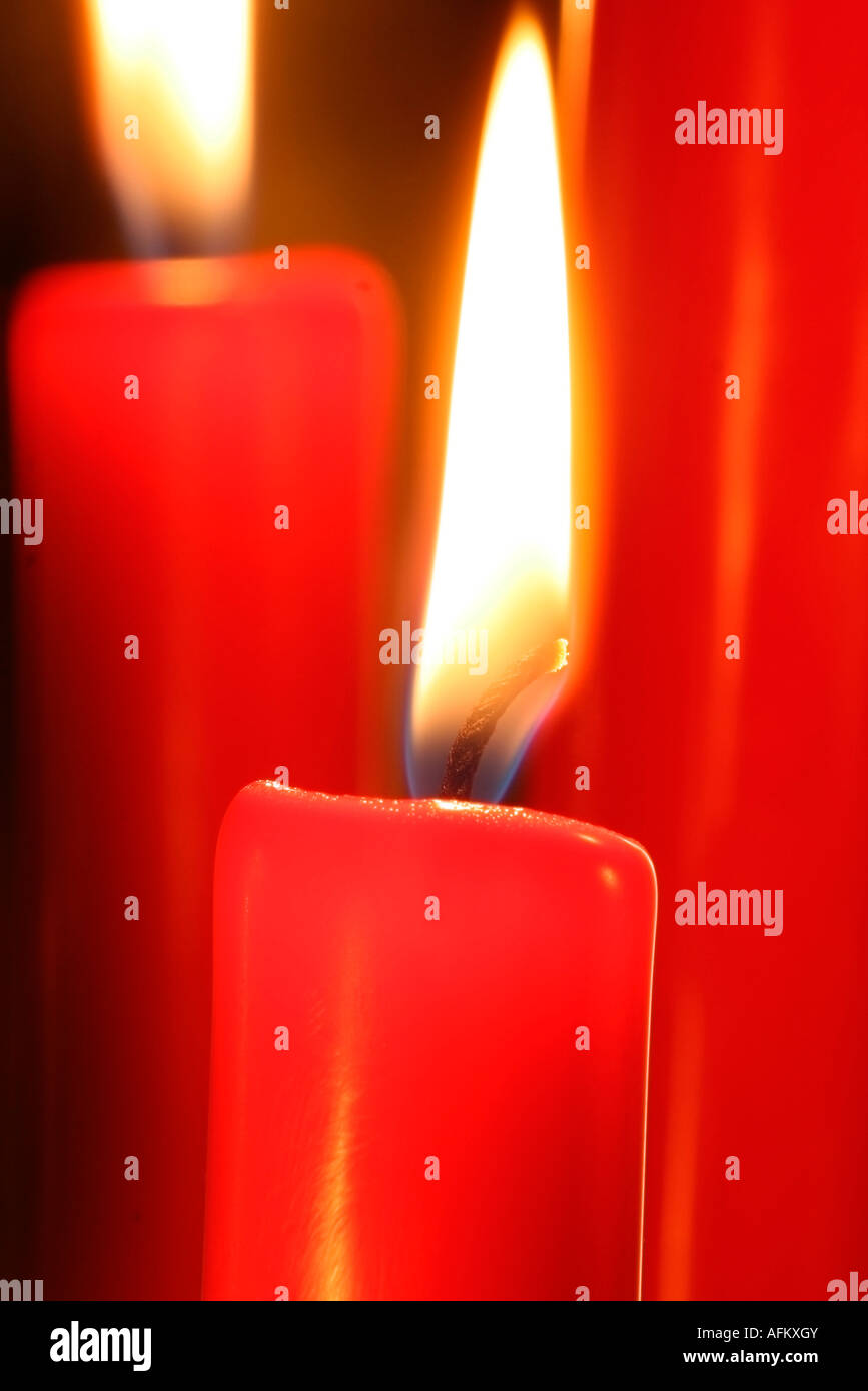 Group of candles with orange flames hi-res stock photography and images ...