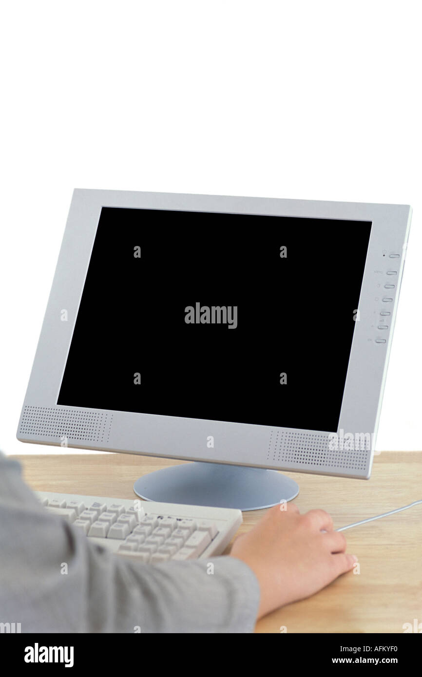 Using computer with blank TFT monitor and plain white background Stock ...