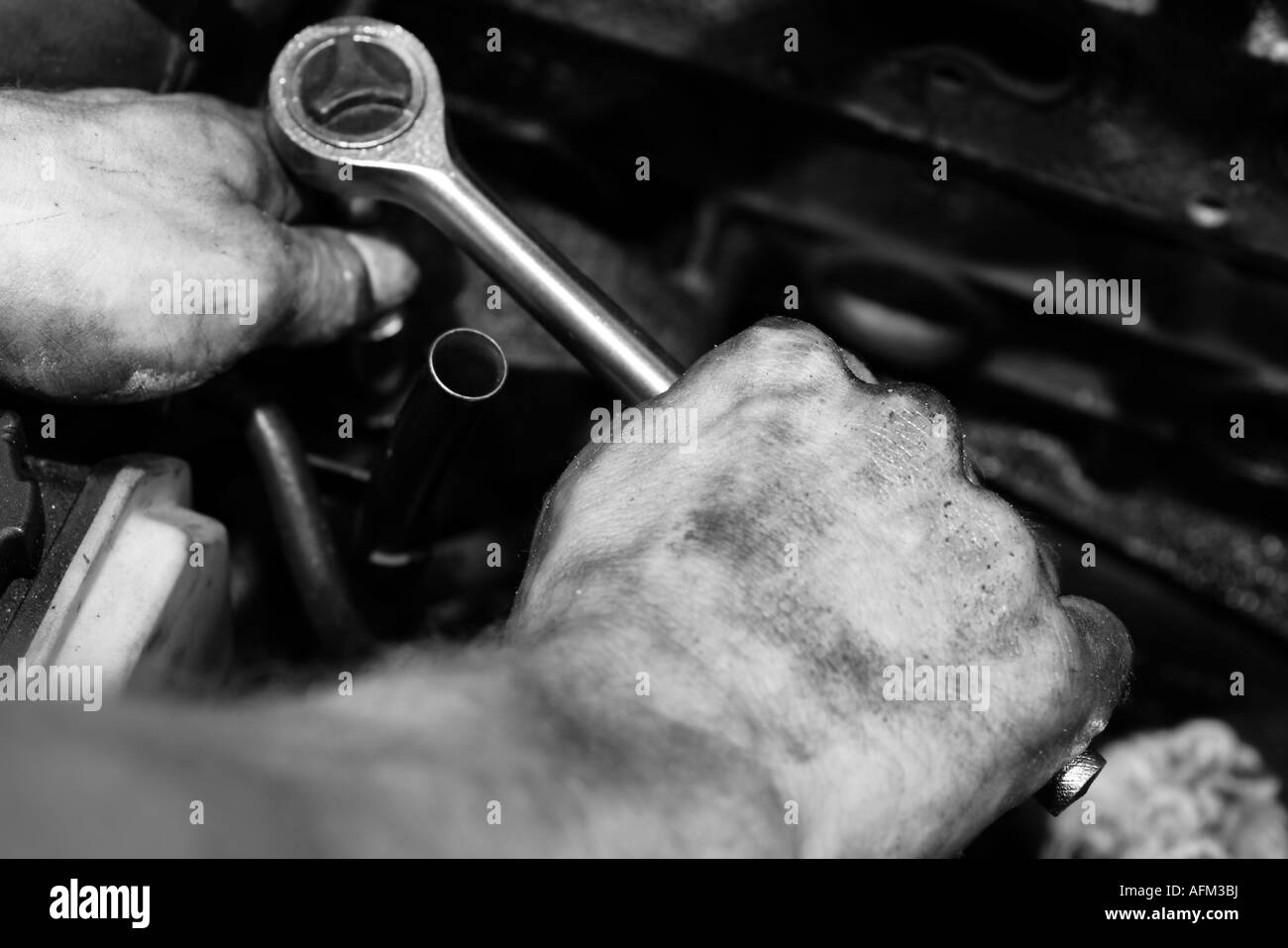 mechanic at work repairing an engine Stock Photo - Alamy