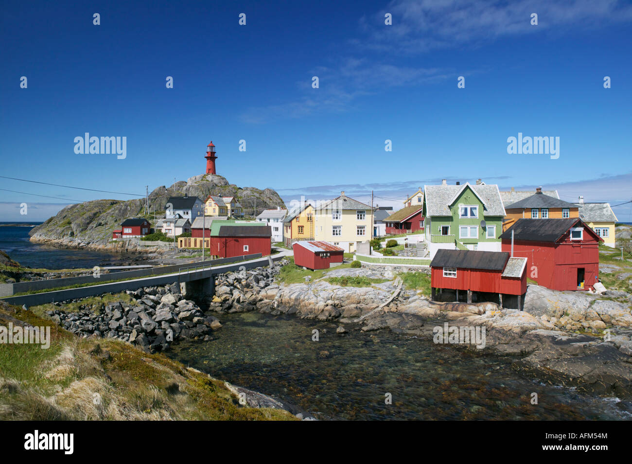 The Ona lighthouse on Onakalven above the fishing village of Ona Sandoy ...