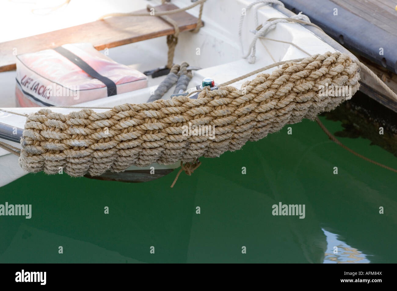 Detailed rope work protect the front of a boat Stock Photo - Alamy