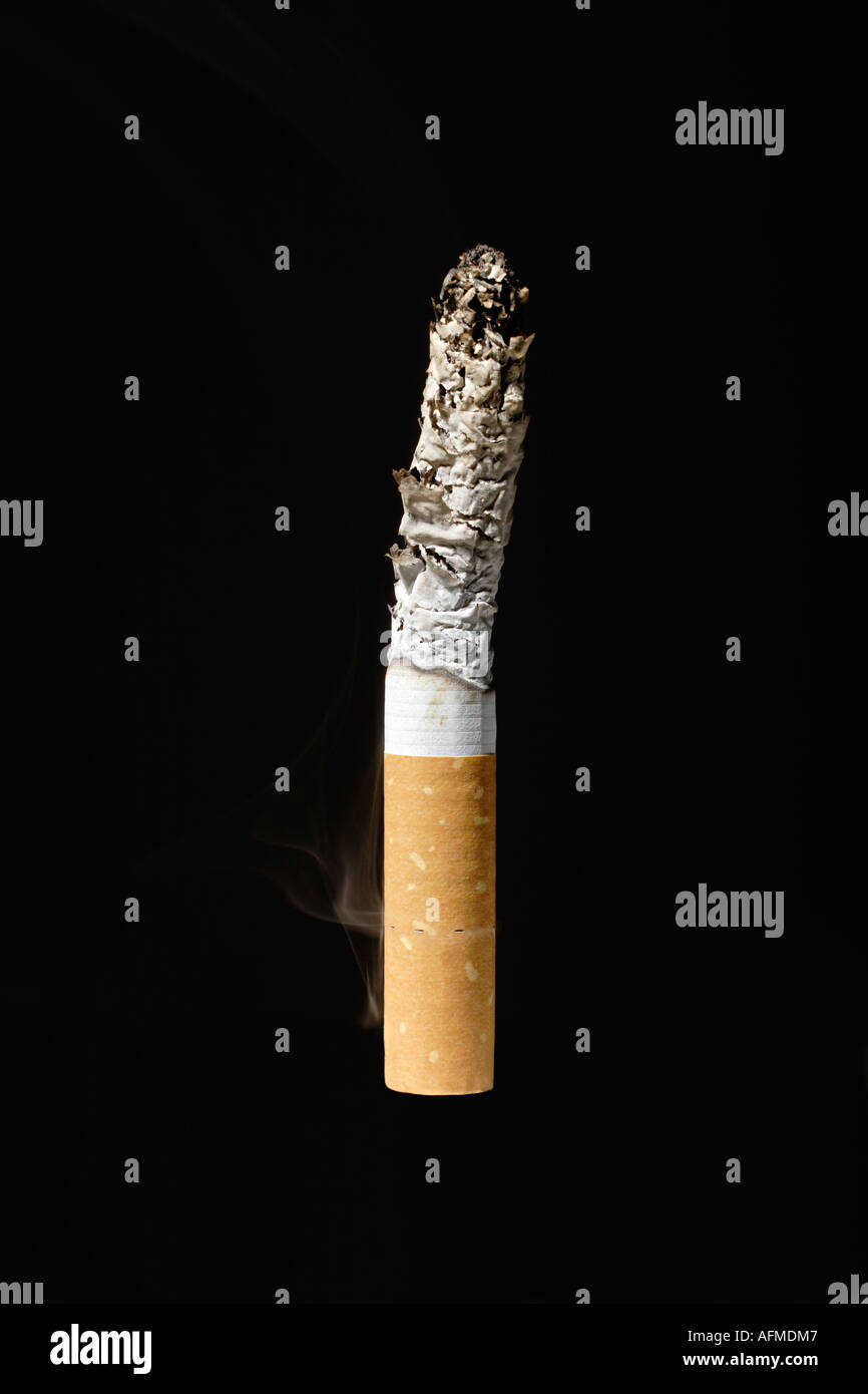 Single burning cigarette with smoke on black background, isolated Stock ...