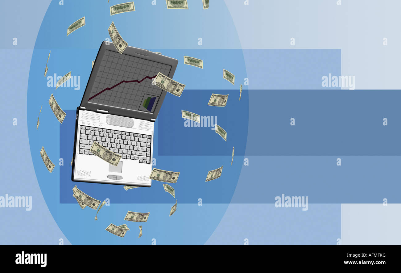 Laptop with paper currency flying Stock Photo - Alamy