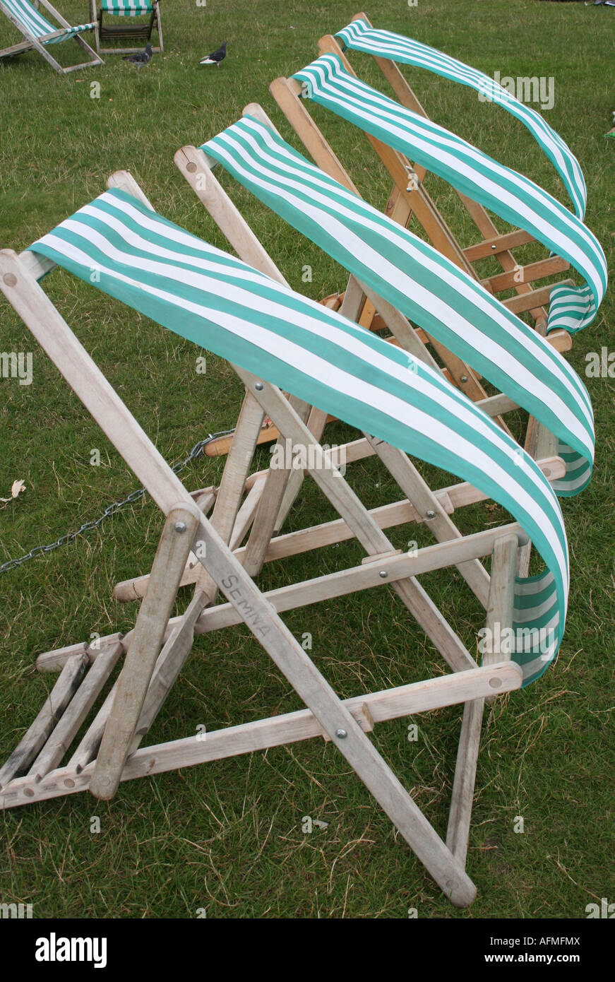 Four Deck Chairs Blowing in the Wind Stock Photo - Alamy