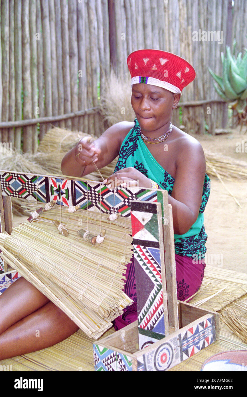 A native African woman demonstrating how to weave Stock Photo - Alamy