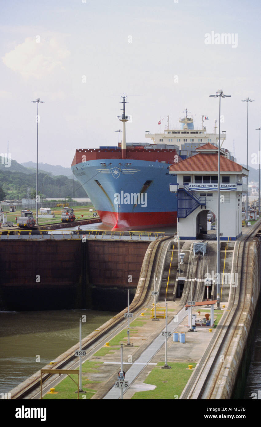 A ship on transit through a set of locks in the Panama Canal Stock ...