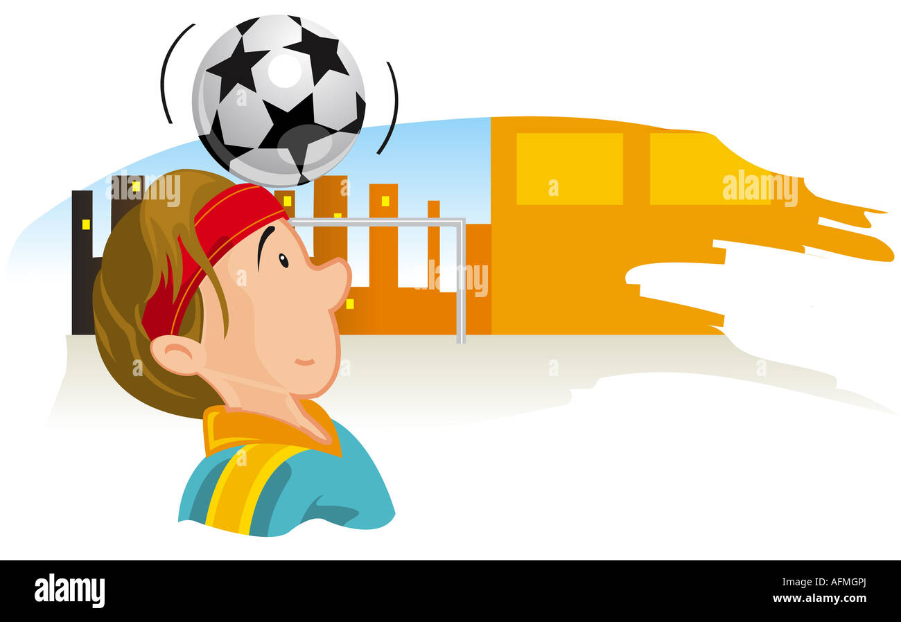 Boy heading a football Stock Photo - Alamy