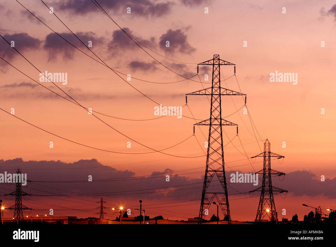 U K Pylons over cityscape Stock Photo - Alamy