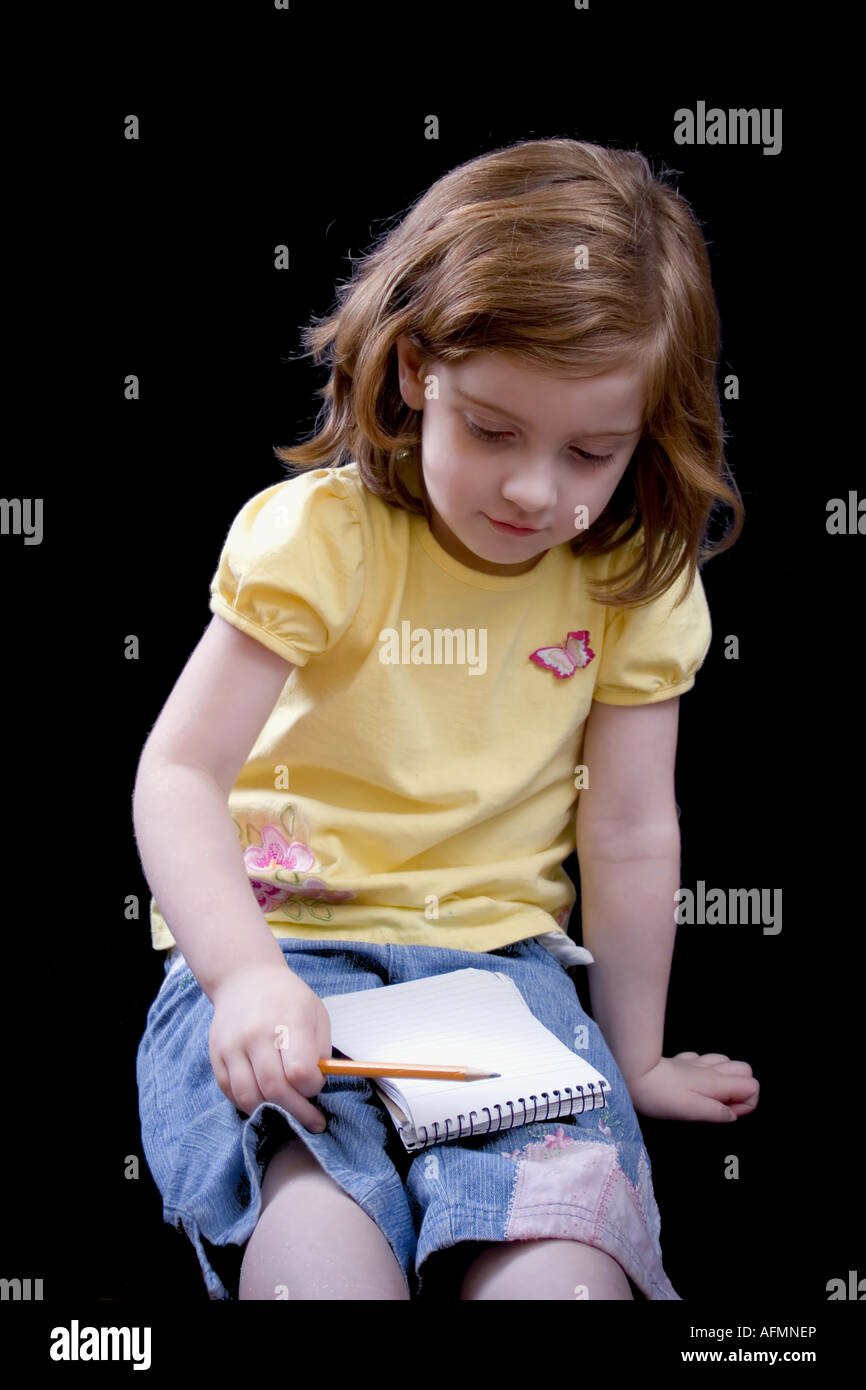 Little girl learning to write Stock Photo - Alamy