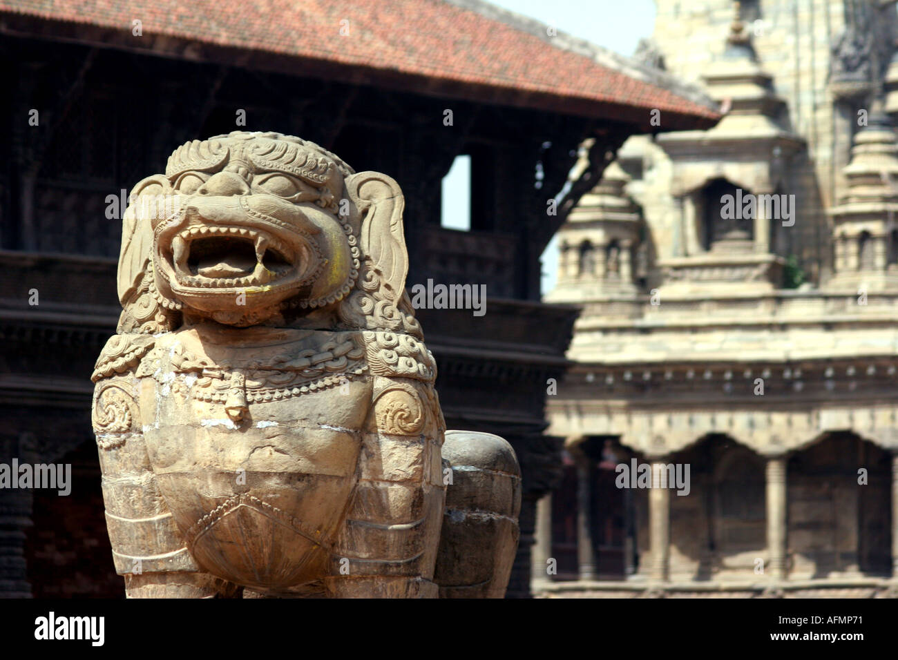 Stone lion god sculpture stands guard in front of a Hindu temple in ...
