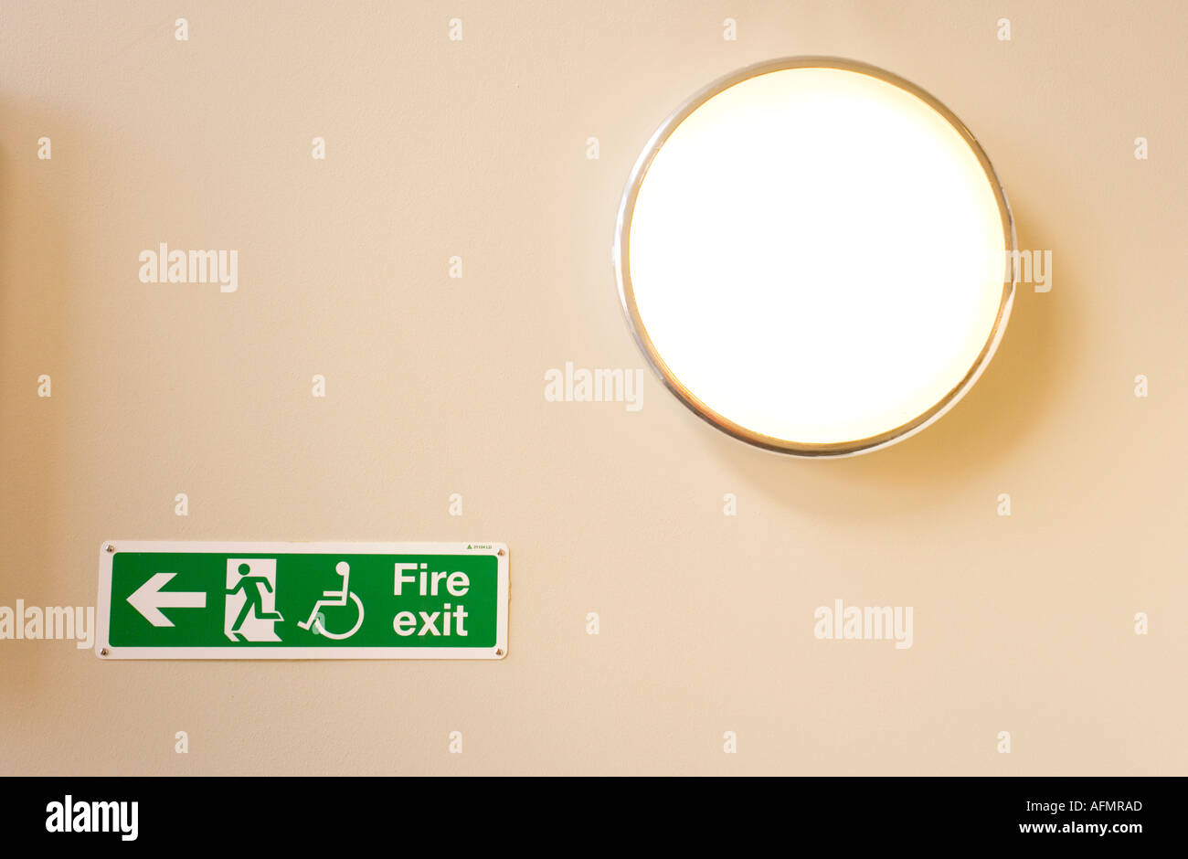 Fire Exit Signs and Lights on Wall UK Stock Photo - Alamy