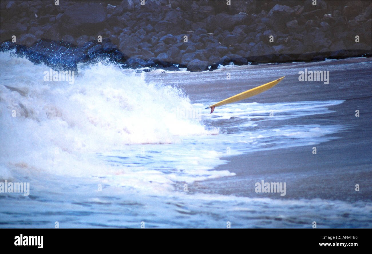 7590 riderless surfboard thrown ashore by waves Pacific Ocean surf Oahu ...