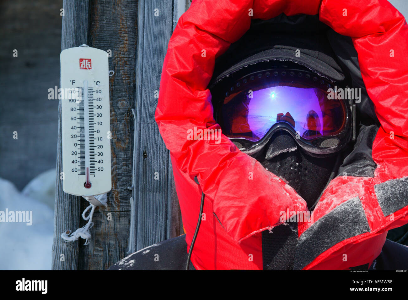 Person with thermometer showing temperature of 48 degrees C below zero ...