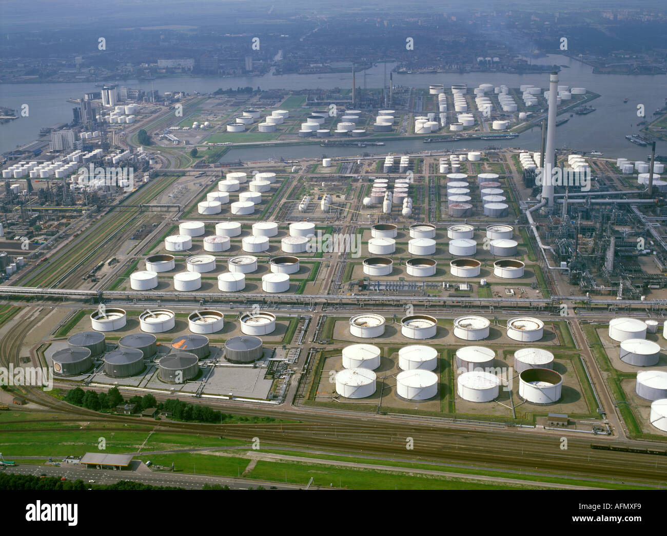Aerial view of the harbour of Rotterdam with oil refinery storage tanks ...