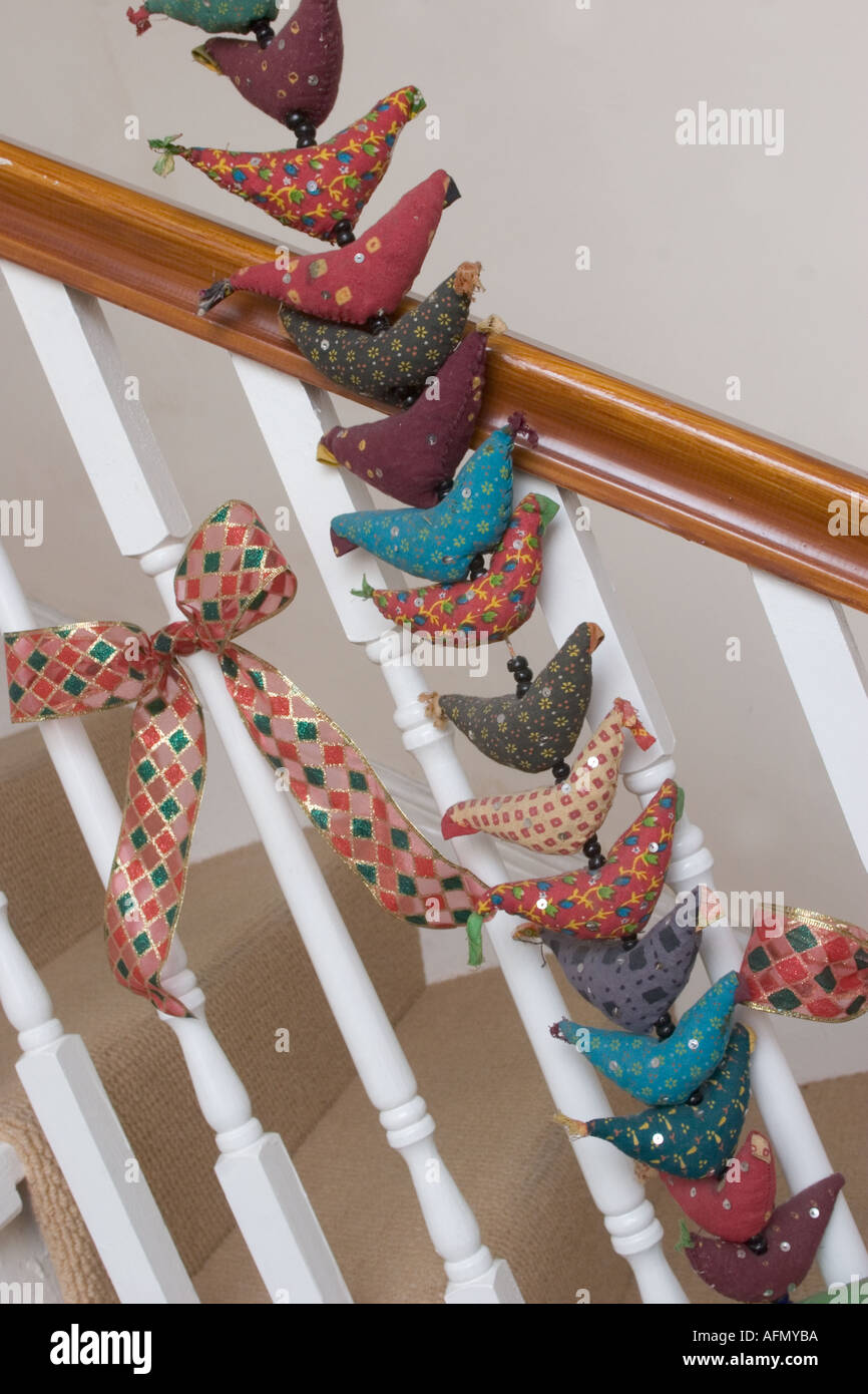 String of stuffed birds decoration on stair bannisters Stock Photo - Alamy