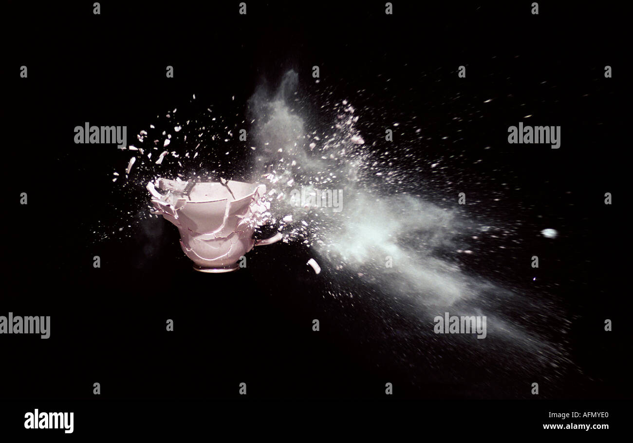 High speed photography showing a teacup exploding on impact from 22 ...