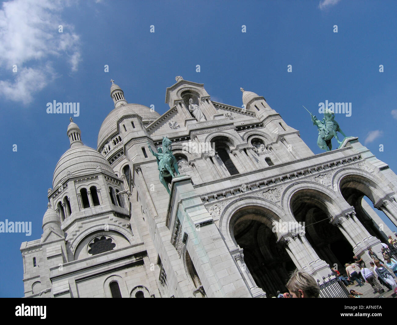 Slanting view in frog eye perspective of Sacre Coeur Montmartre Paris ...