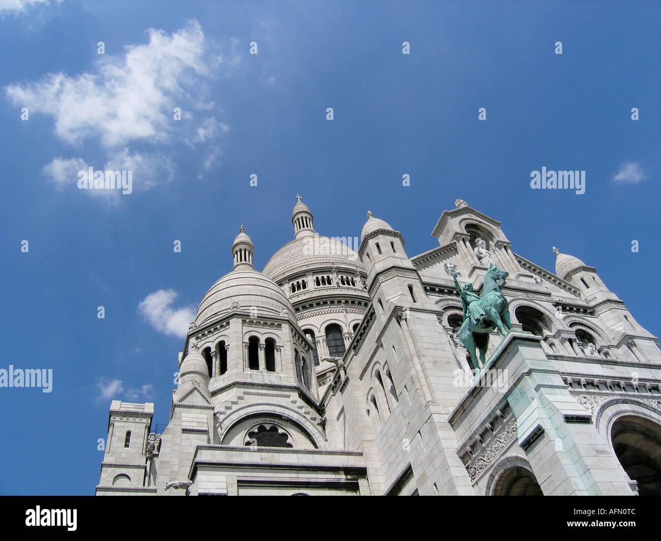 Slanting view in frog eye perspective of Sacre Coeur Montmartre Paris ...