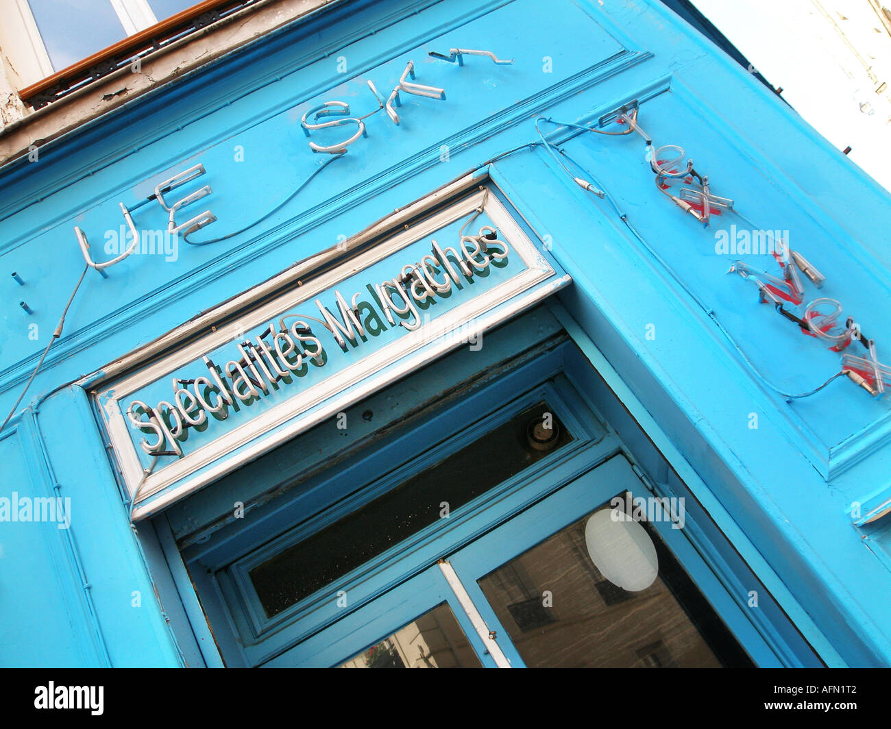 Desolate blue painted shop front of small shop in Montmartre Paris ...