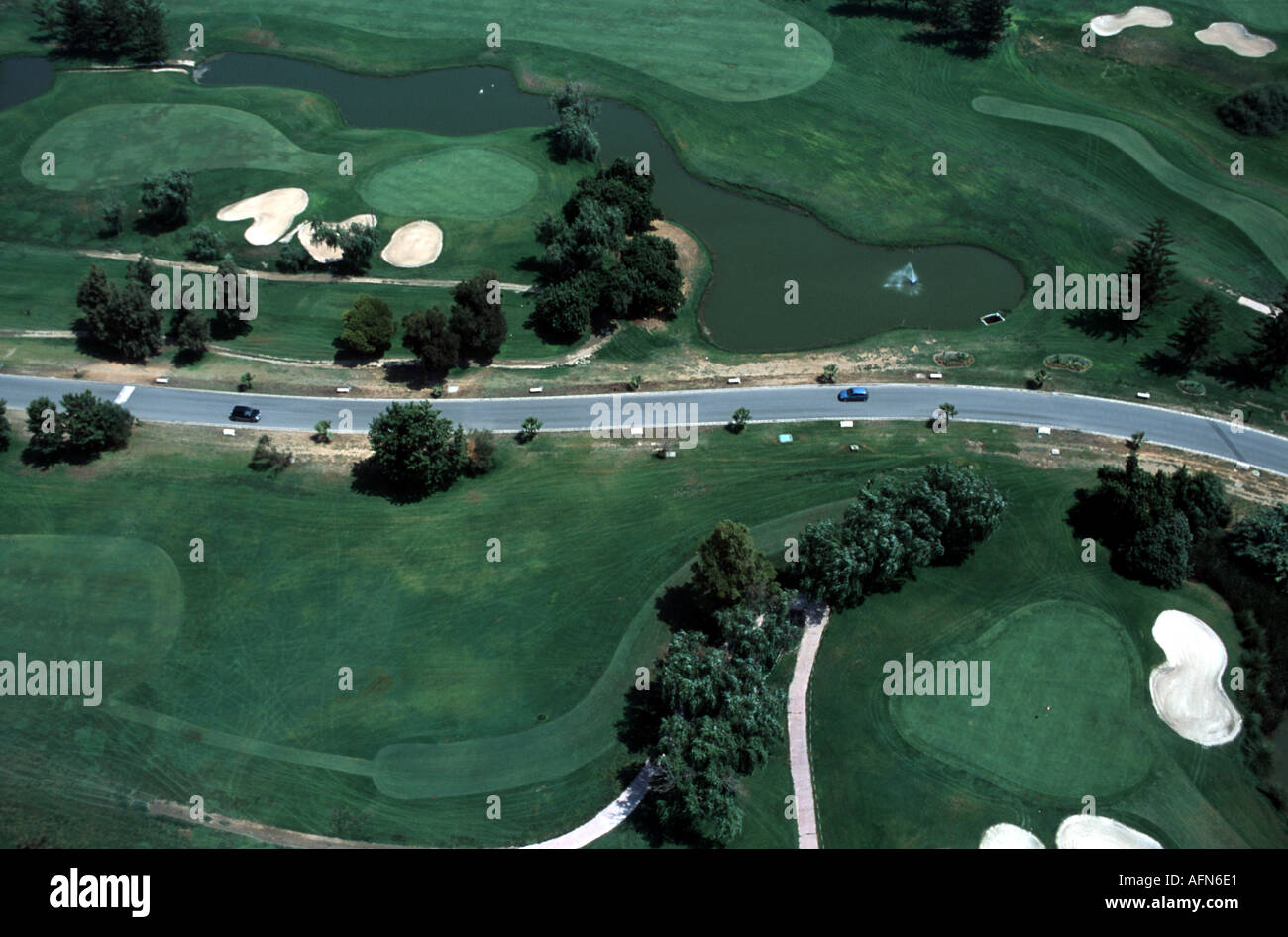 Aerial view of golf course and road Stock Photo - Alamy