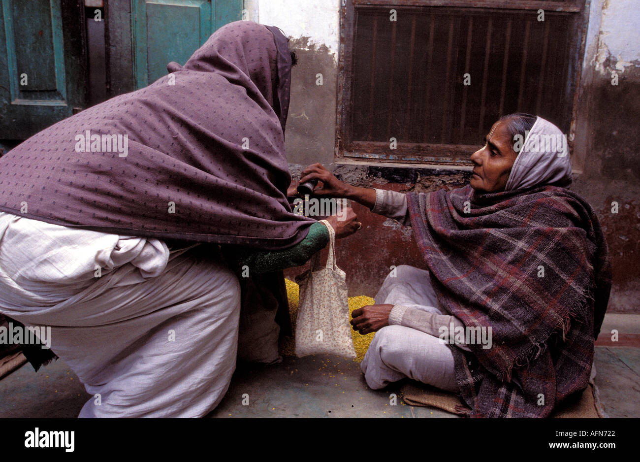 India Uttar Pradesh Vrindavan A widow is given 50gr of lentils and ...