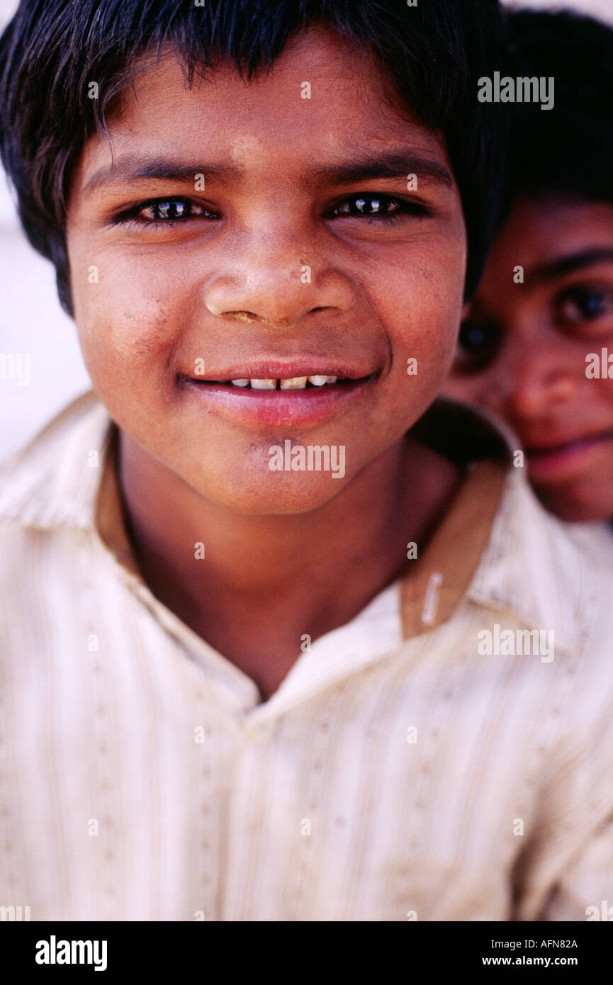 Portrait of young Indian boys smiling posing for the camera India Asia ...