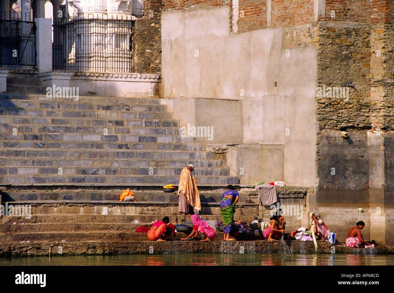 Indian women bathing washing clothes hi-res stock photography and ...