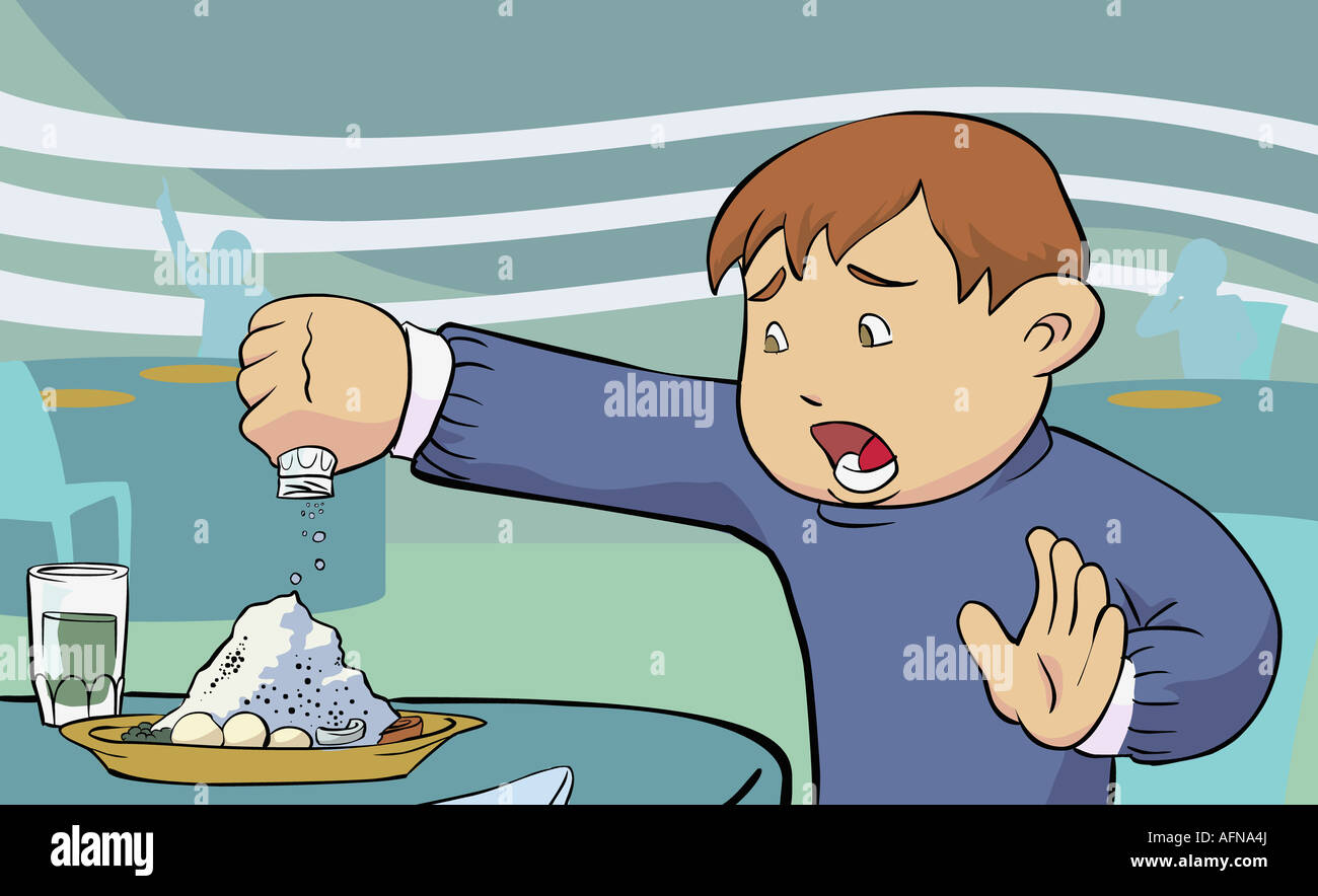 Boy pouring salt on food Stock Photo - Alamy