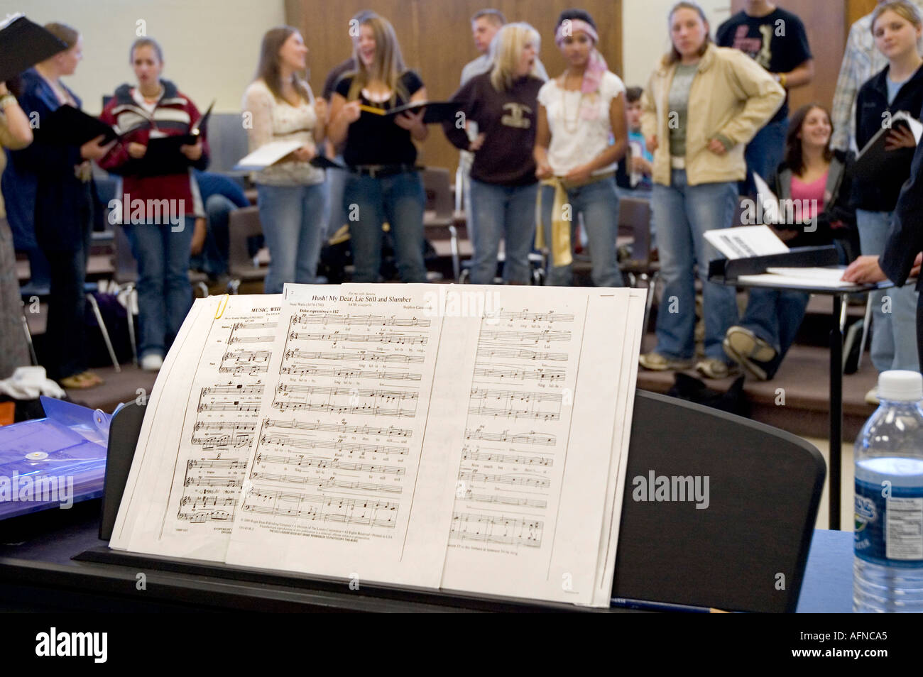 Teacher directs music choir as they prepare for a performance Stock ...