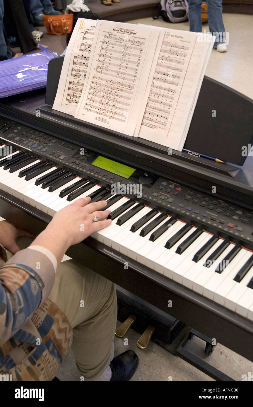 Teacher directs music choir as students prepare for a performance Stock ...