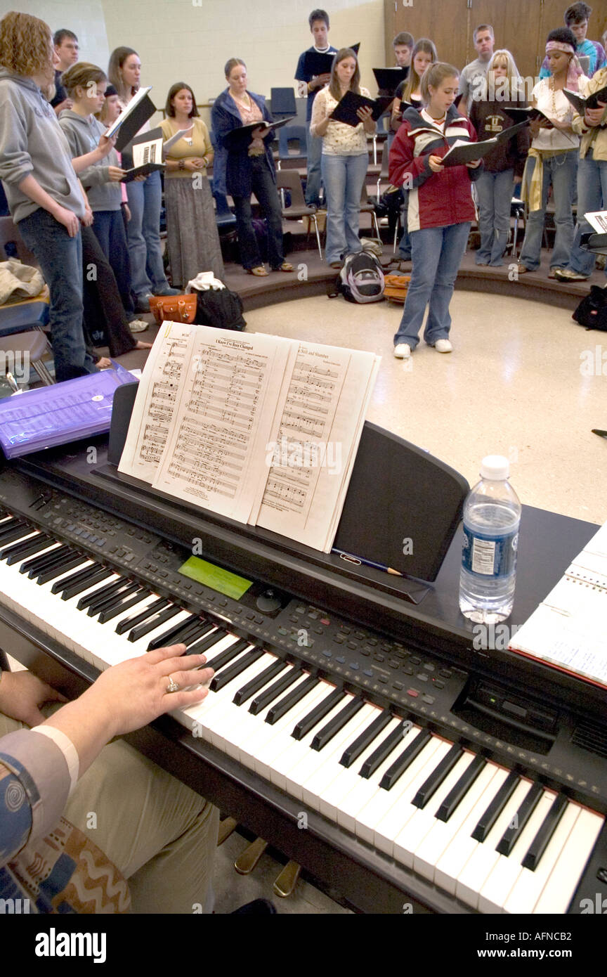 Teacher directs music choir as students prepare for a performance Stock ...