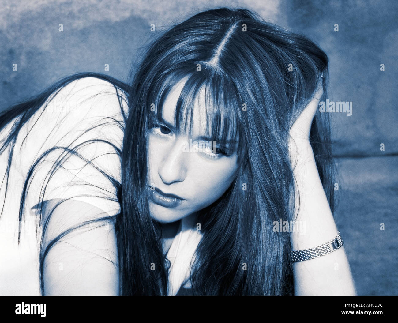 Woman holding her head Stock Photo - Alamy