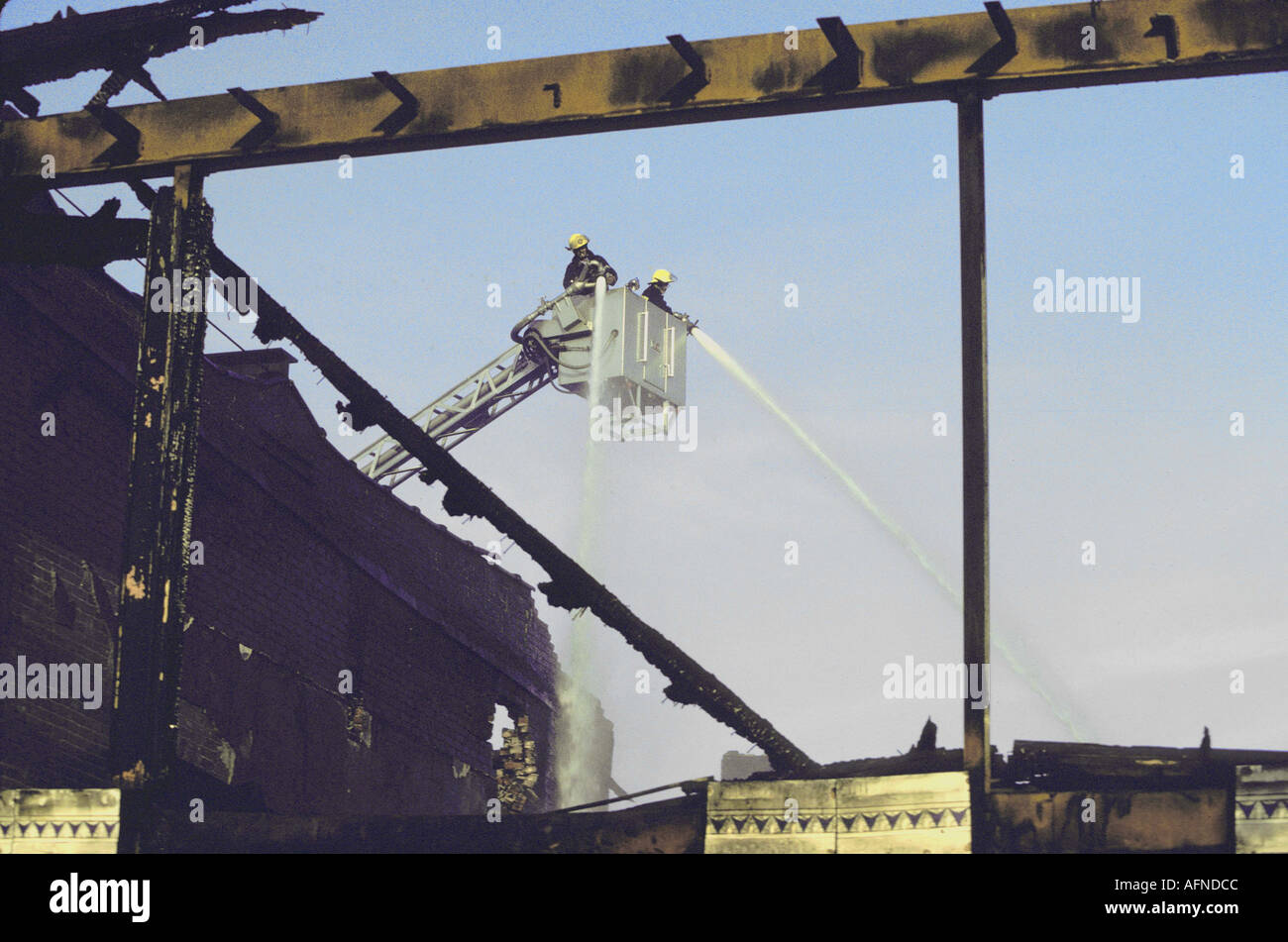 Fireman fight a fire from elevated basket Stock Photo - Alamy