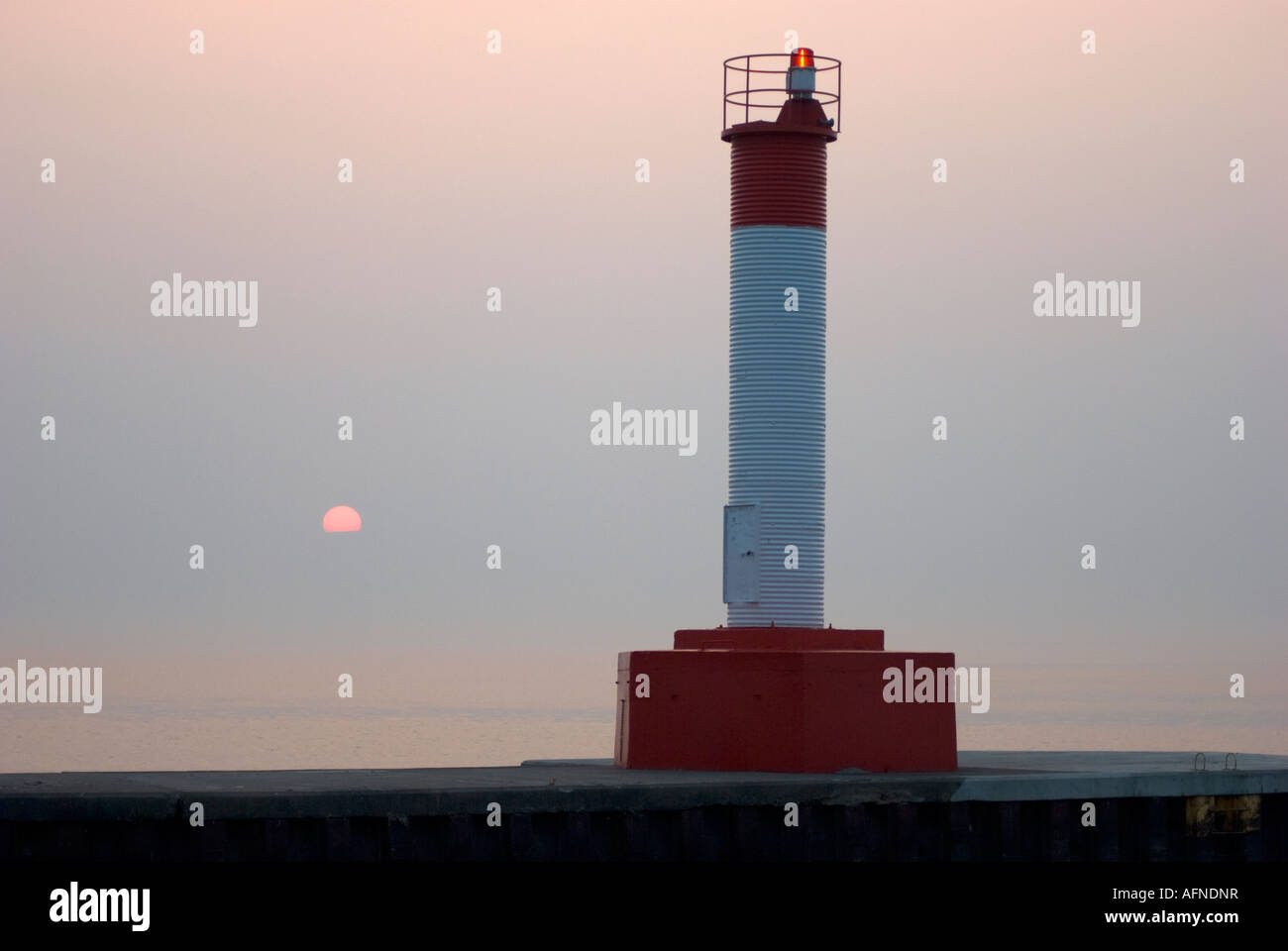 Lighthouse at sunrise Stock Photo - Alamy