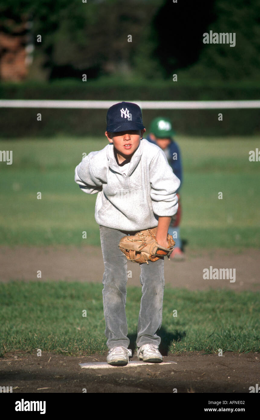 little league baseball pitcher stands on the mound ready to throw ...