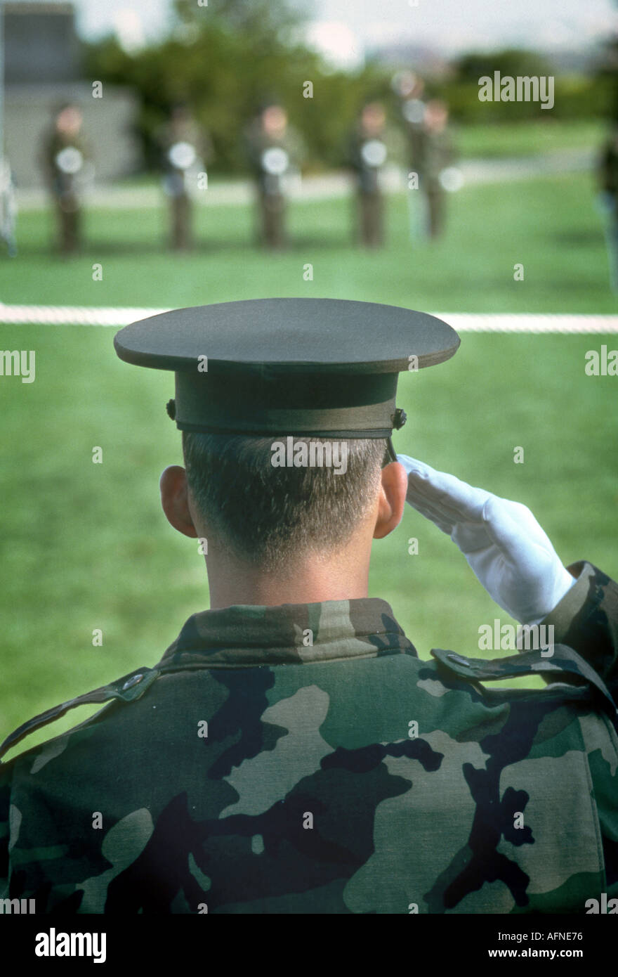 Marine officer salutes the honor guard at the Iwo Jima statue at ...