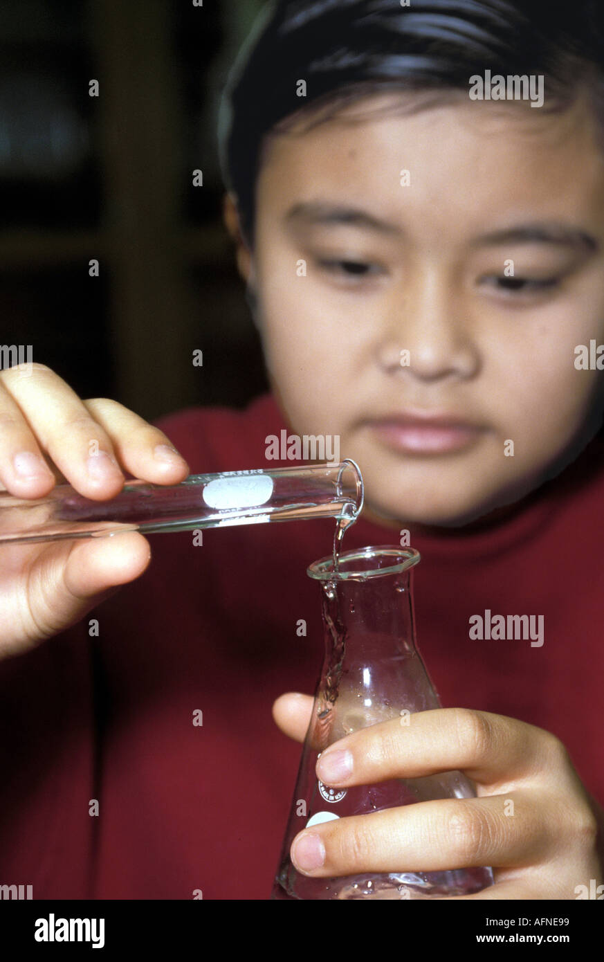 Teenager in school chemistry class hi-res stock photography and images ...