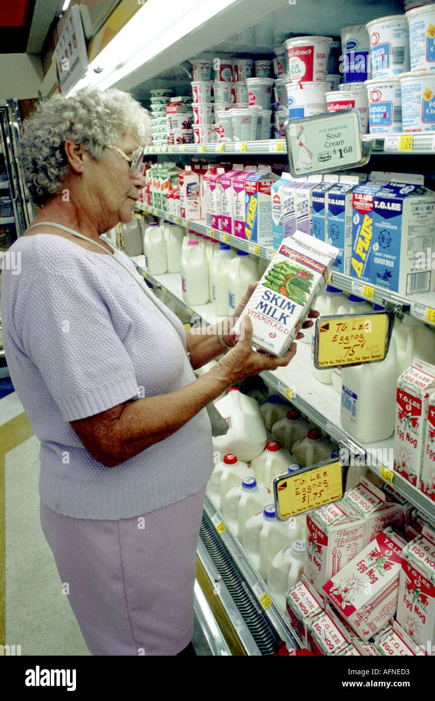 Senior female shopping in a grocery store for food Stock Photo - Alamy