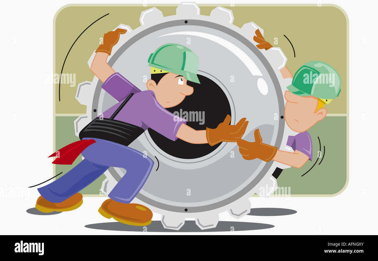 Two young men pushing a gear Stock Photo - Alamy