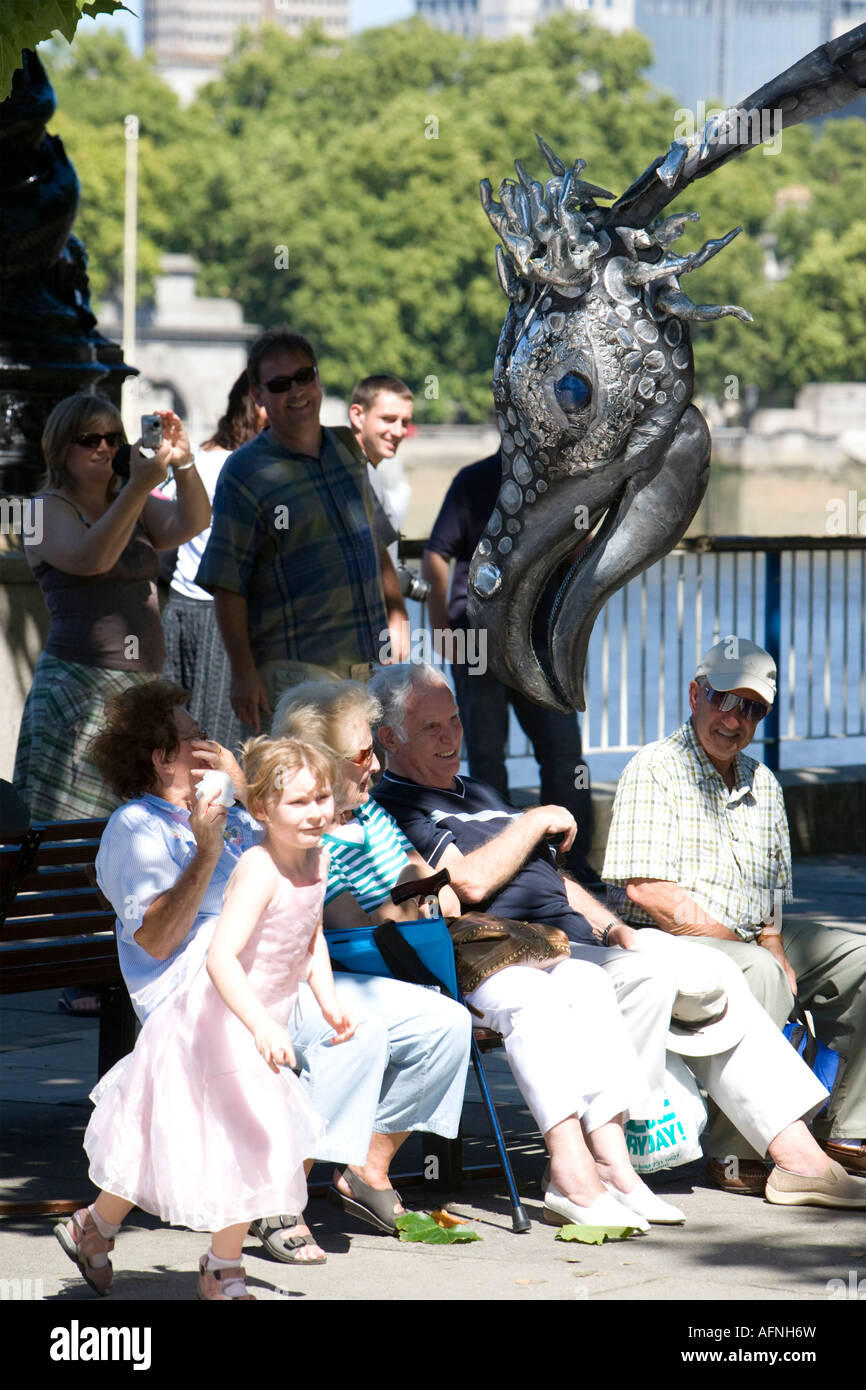Spectators watching open air performance of strange creatures, outside ...