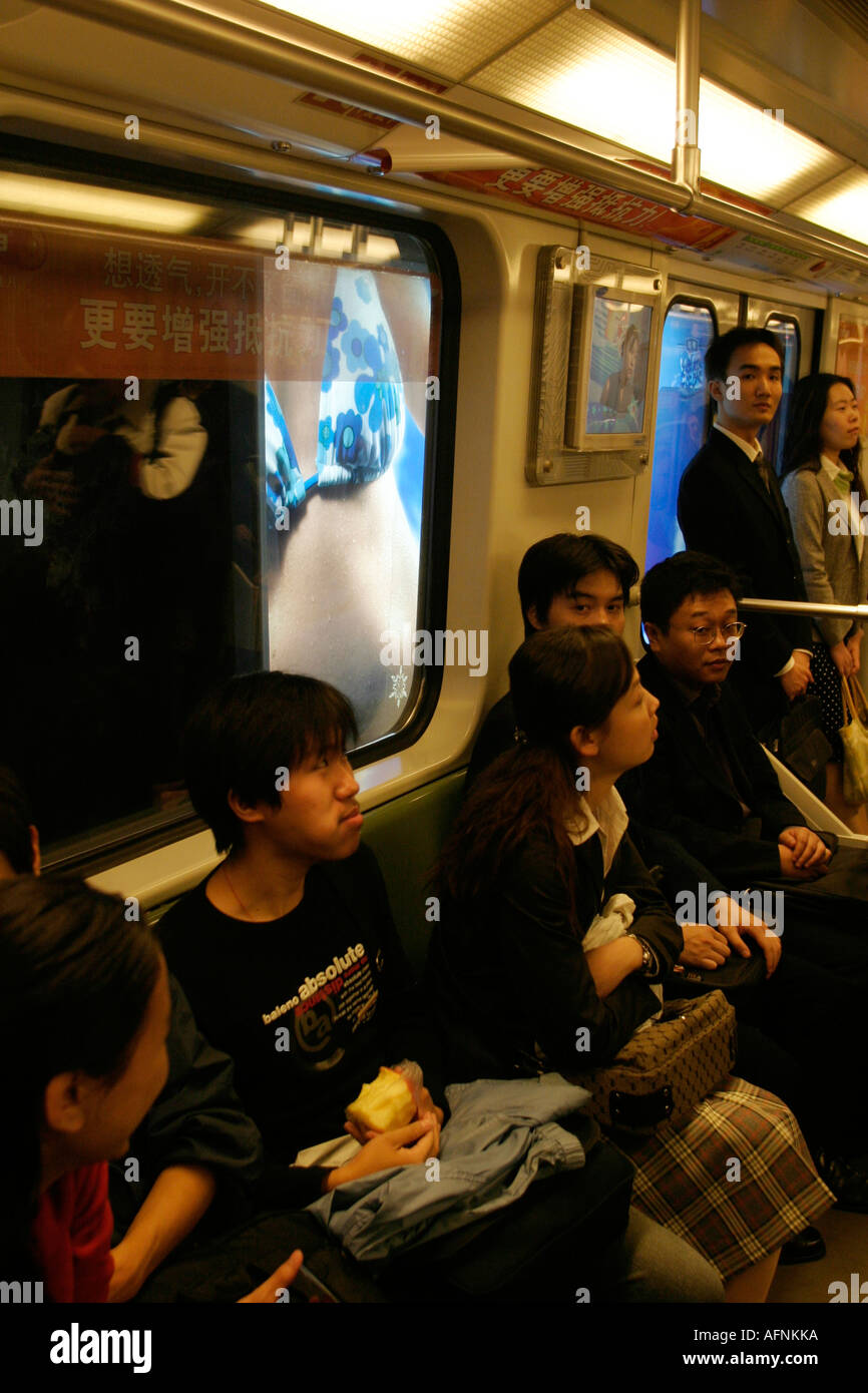 Metro people sitting Stock Photo - Alamy