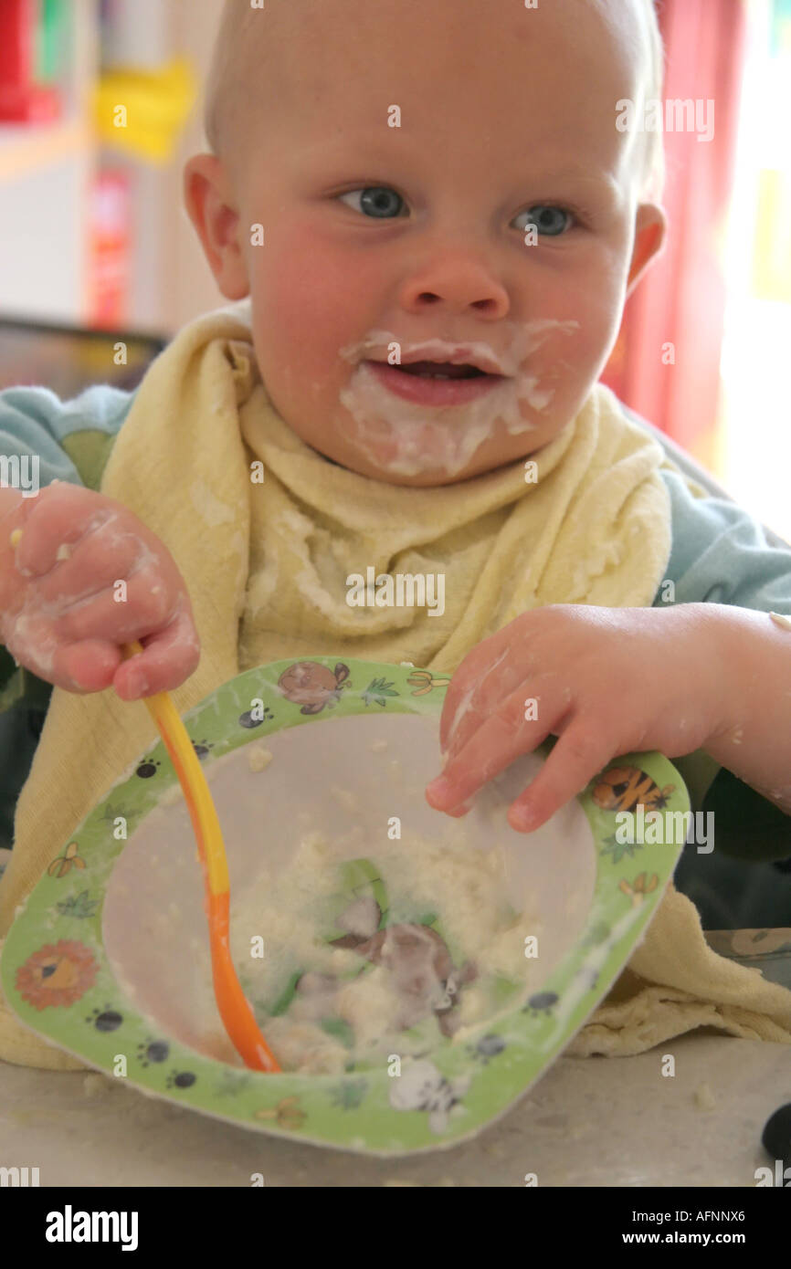 Toddler learning feed himself in hi-res stock photography and images ...