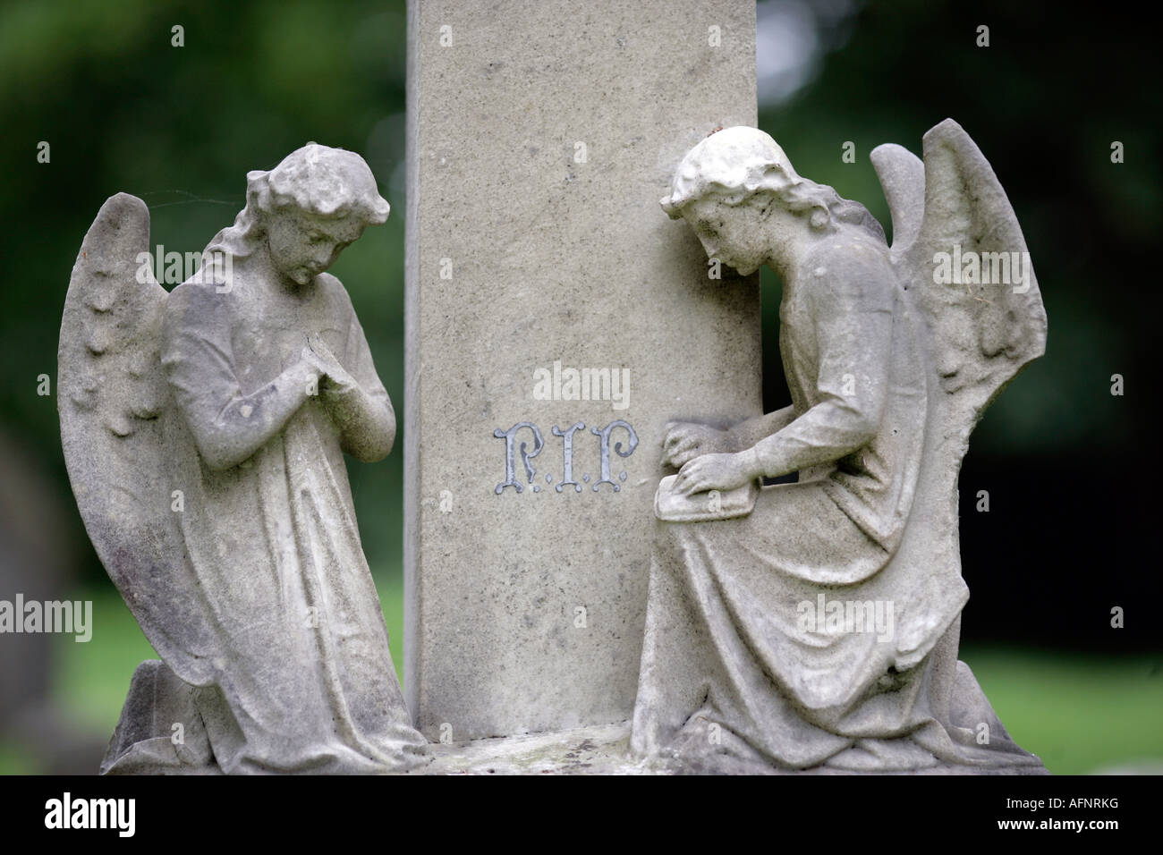 two angels praying statues RIP R I P rest in peace Stock Photo - Alamy