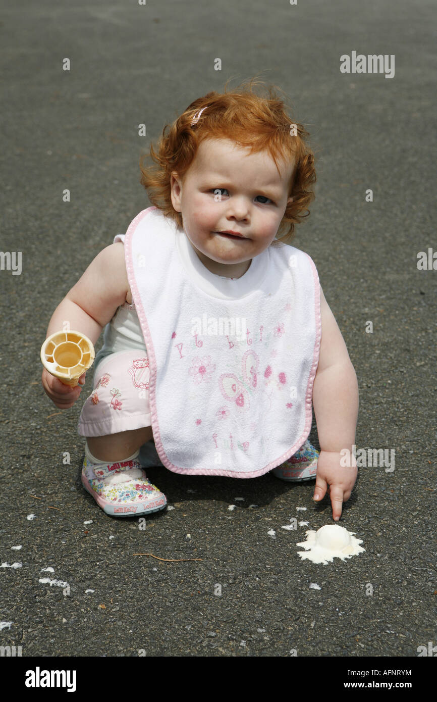 Little girl with her ice cream that has dropped on the floor Stock ...