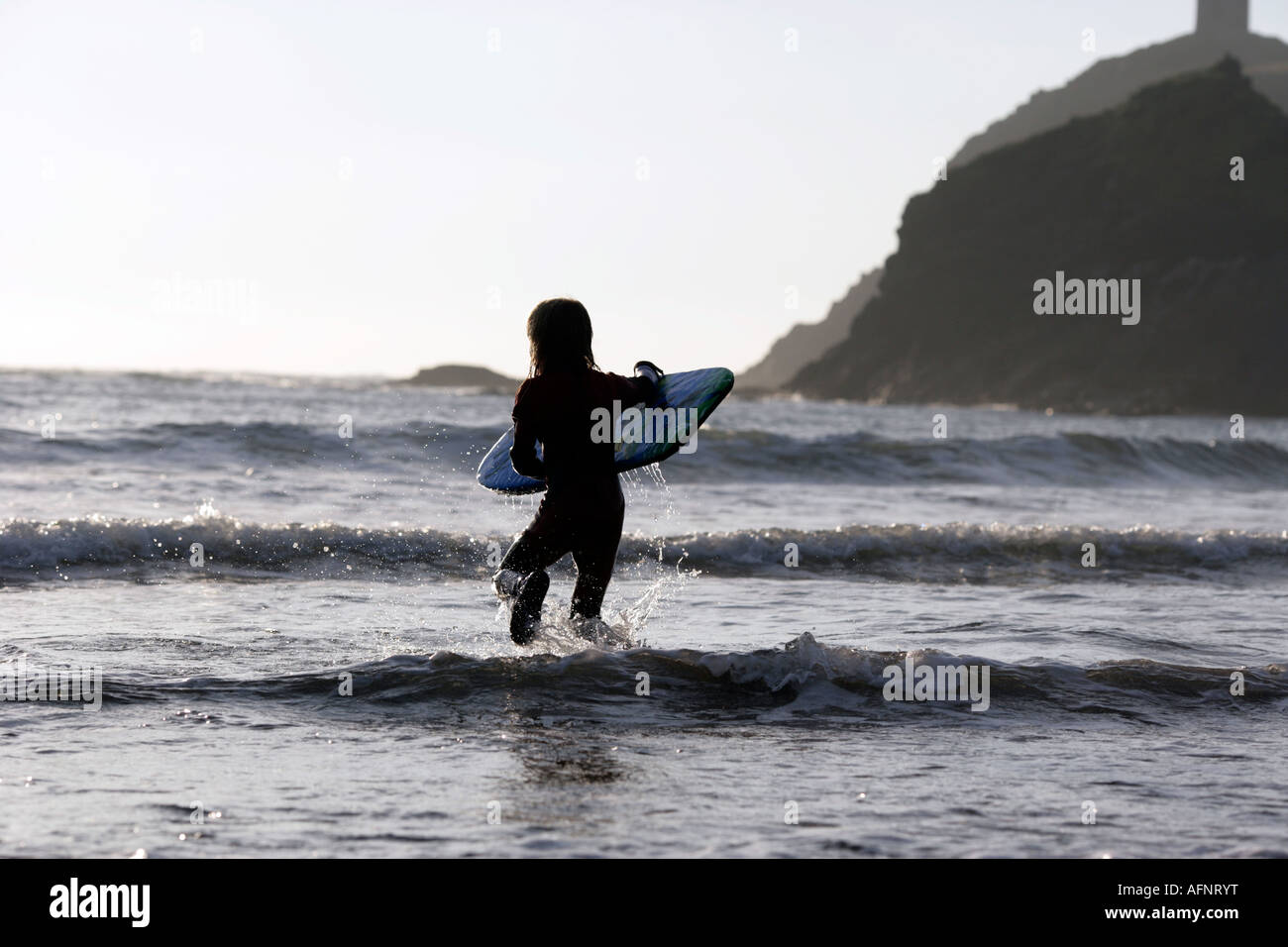young girl in a wetsuit body boarding boogie boogieboard board Stock ...