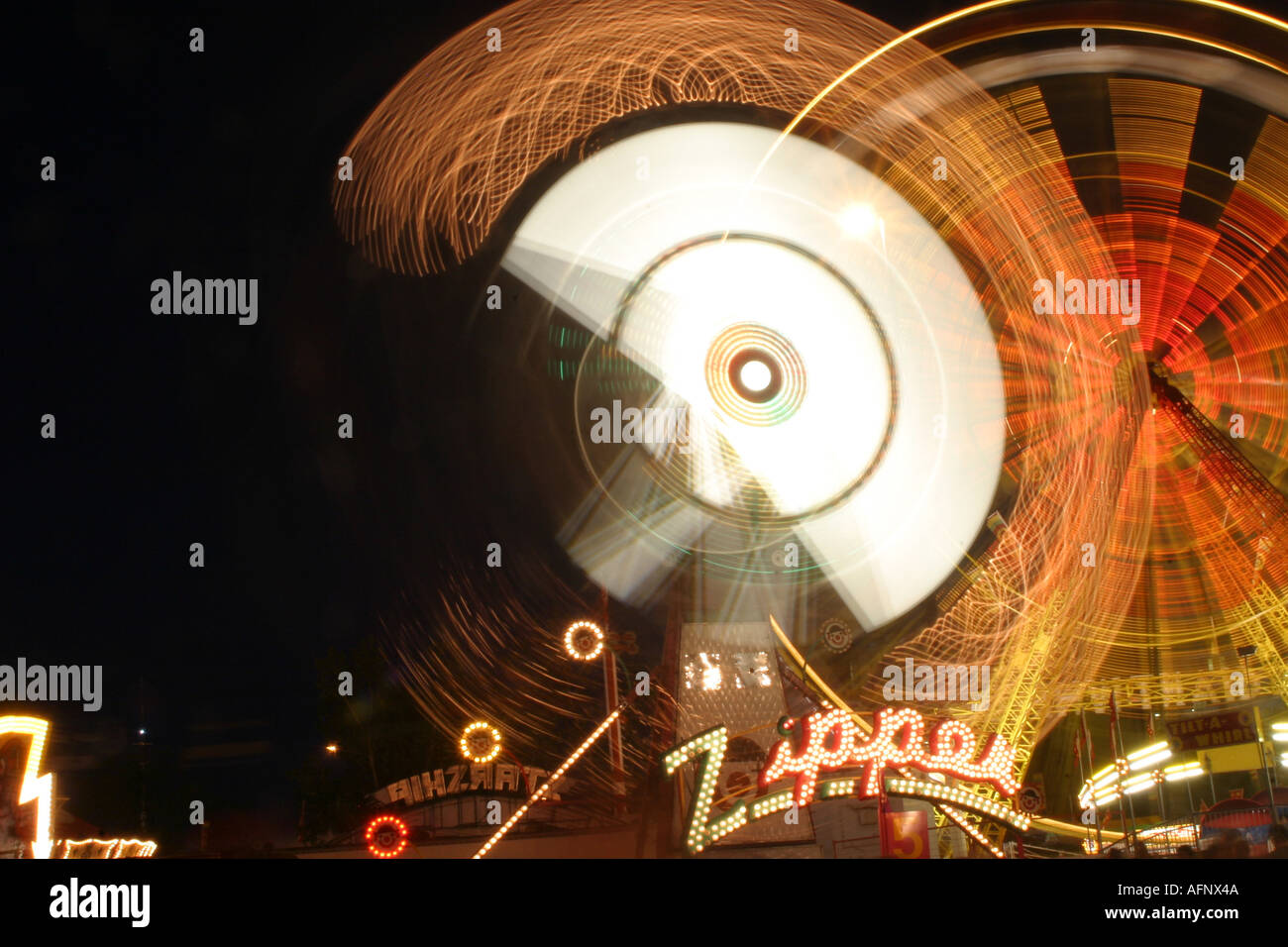 CARNIVAL RIDES Night time on the midway at the Calgary Stampede ...