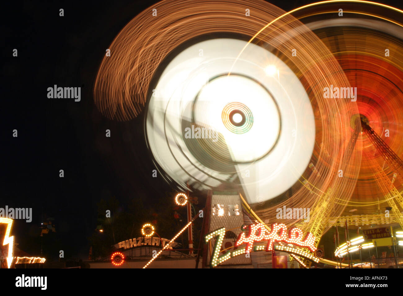 CARNIVAL RIDES Night time on the midway at the Calgary Stampede ...