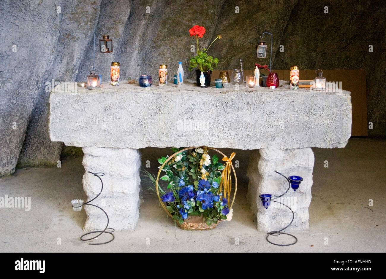 Cave grotto with religious symbols and altar Stock Photo - Alamy
